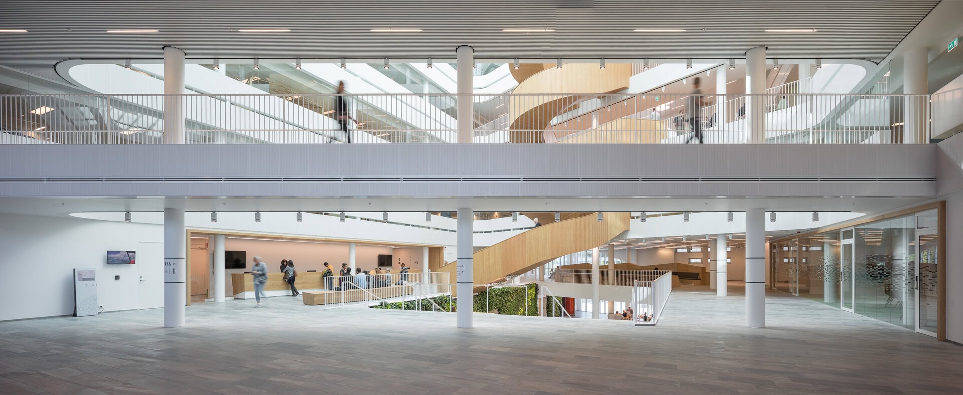 A stair with vertical garden connects the two entrances